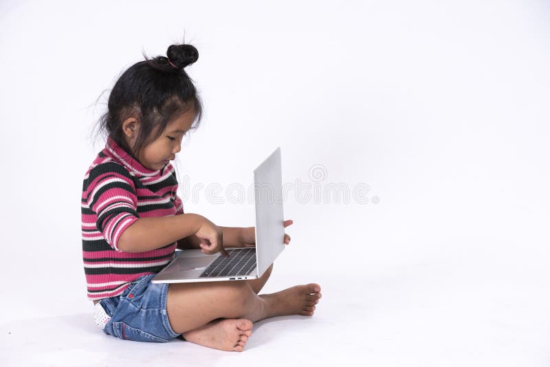 Little girl using laptop stock image. Image of casual - 180805237
