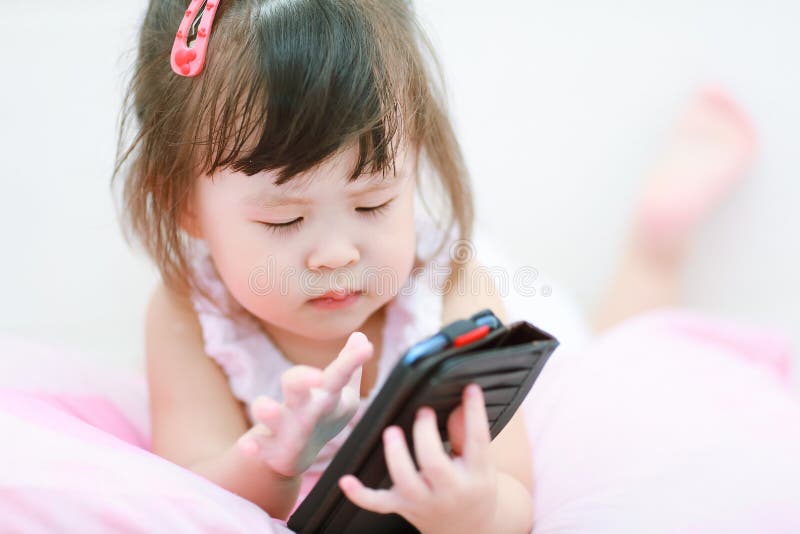 Little Girl Using Mobile Phone Stock Image - Image of face, mobile ...