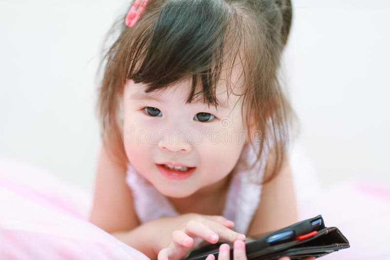 Little Girl Using Mobile Phone Stock Photo - Image of communication ...