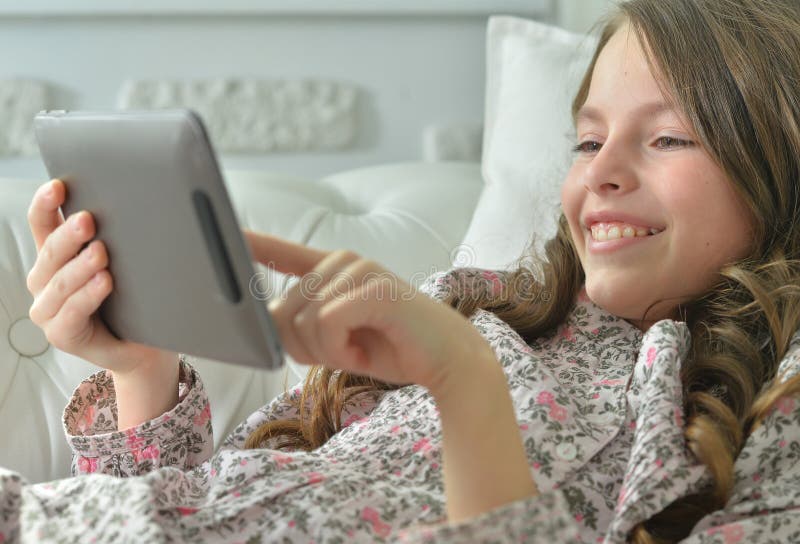 Little girl using tablet stock image. Image of research - 94160983