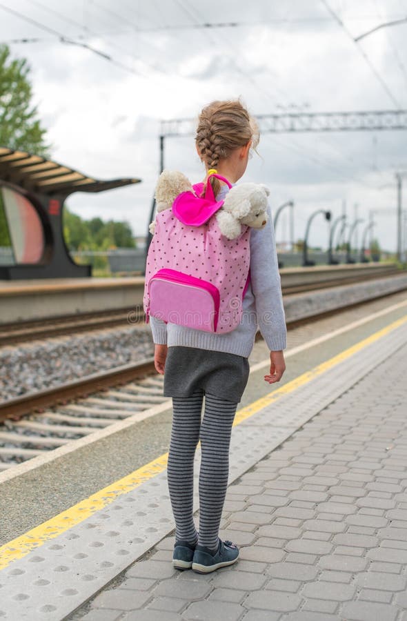 Little Girl Waiting for Train. Stock Image - Image of bear, back: 56934021