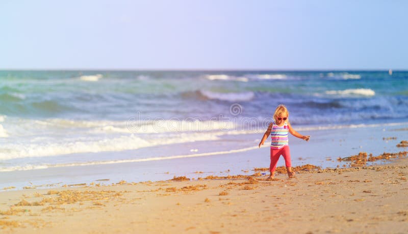 Little Girl Walk on Sand Beach Stock Image - Image of play, beach: 72470441