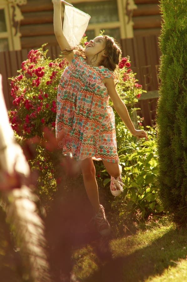 Little Girl Walking with the Ring-net Stock Photo - Image of flowers ...