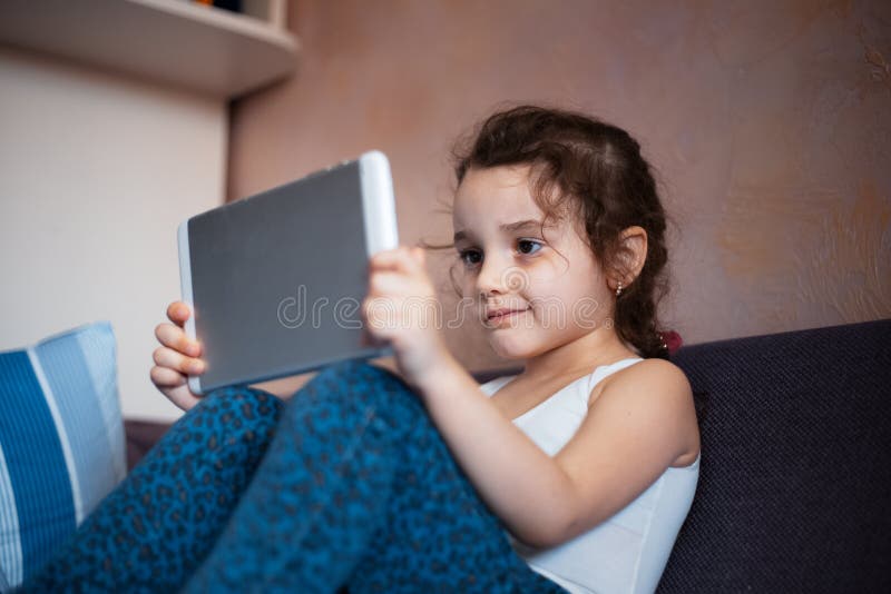 Little Girl Watching Cartoons on the Tablet Stock Image - Image of ...