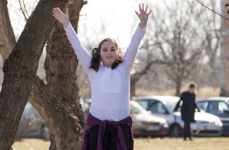 Little girl waving in park stock photo. Image of little - 88780032