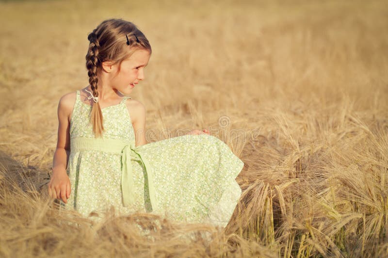 Little girl in wheat field stock photo. Image of person - 25200084