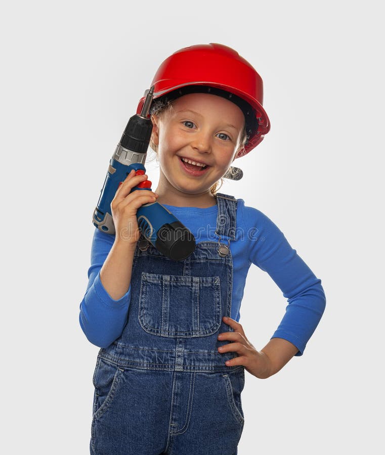 Little Girl Worker in a Safety Helmet with a Tool. Stock Photo - Image ...