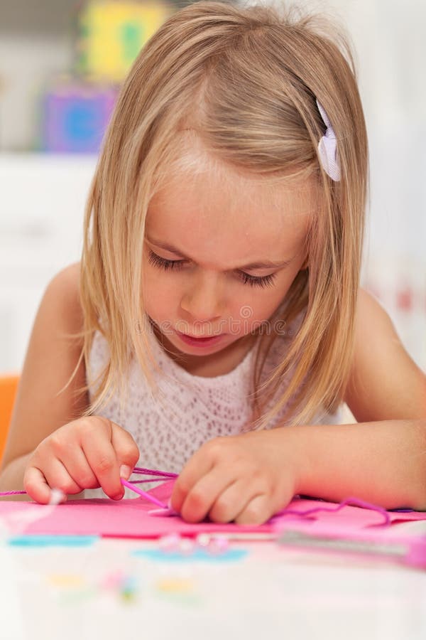 Little Girl Working on a Crafting Project Stock Image - Image of ...
