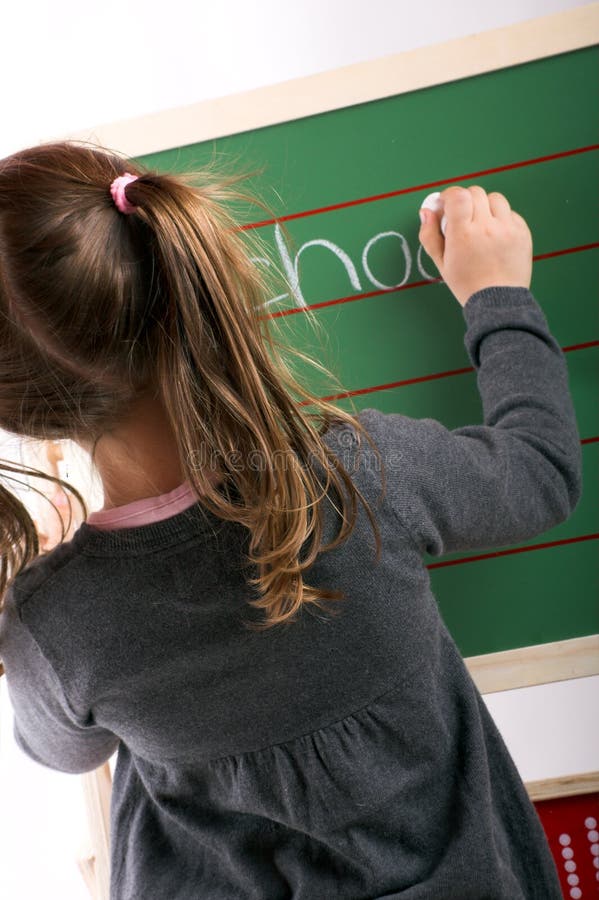 Little Girl is Writing on a Board Stock Photo - Image of student ...