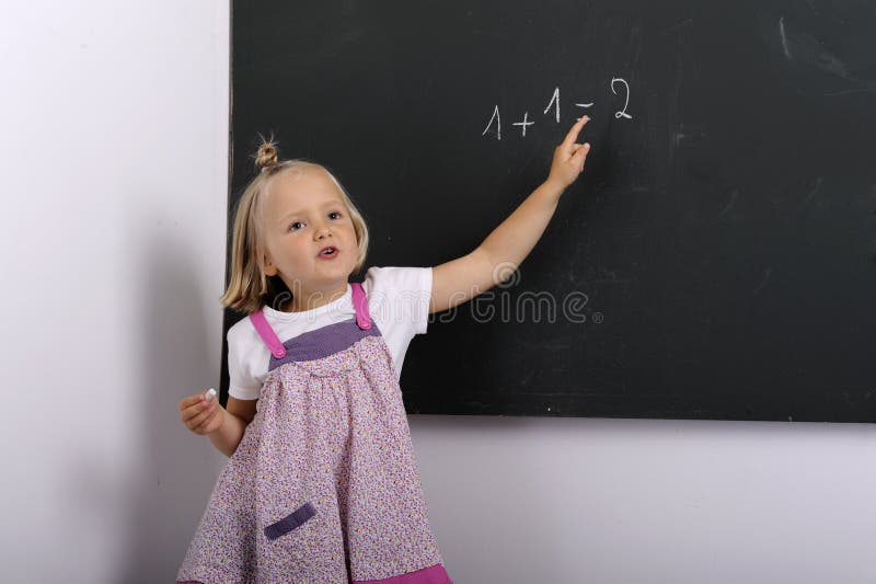 Little Girl Writing on a Chalkboard Stock Photo - Image of math, girl ...