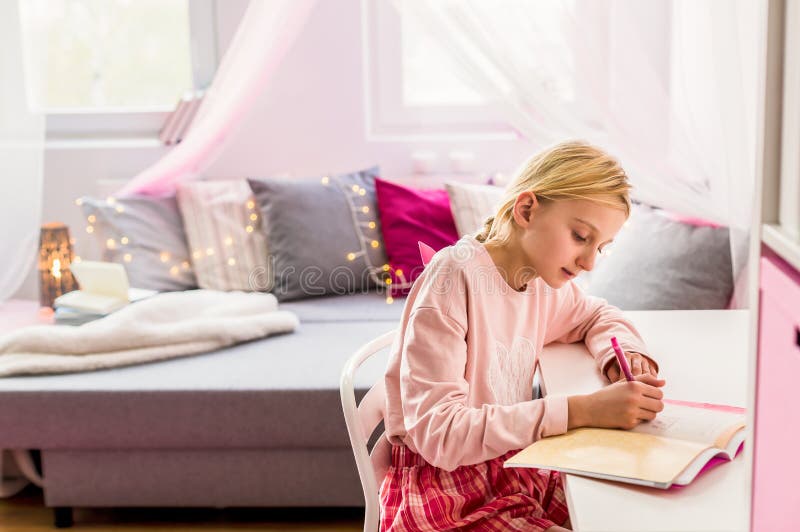 Little girl writing diary stock photo. Image of furniture - 64720772