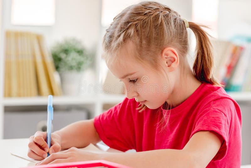Little Girl Writing in Notebook with Pen Stock Image - Image of ...