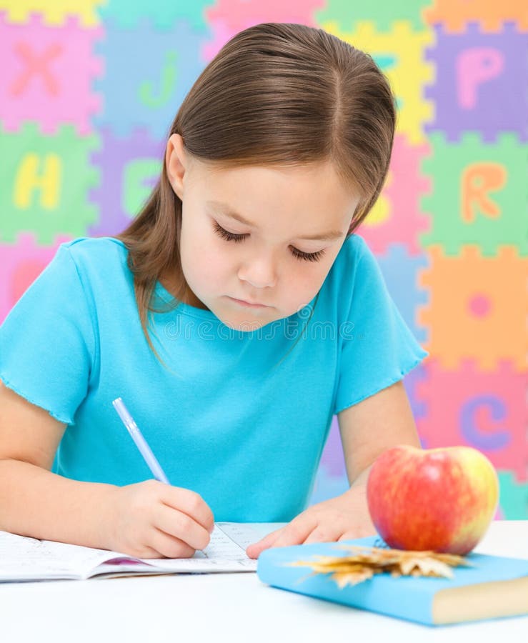 Little Girl is Writing Using a Pen Stock Image - Image of lesson ...