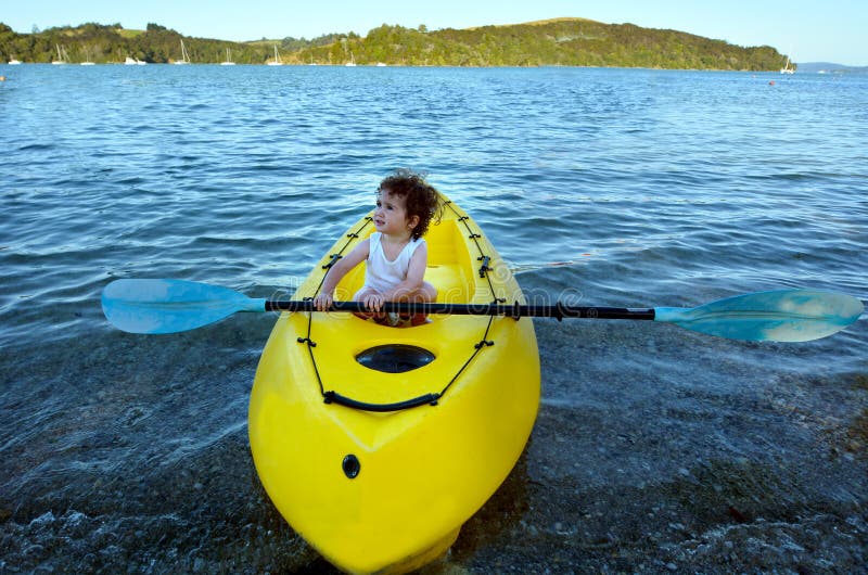 Little Girl on a Yellow Kayak Stock Photo - Image of nature, oceania ...