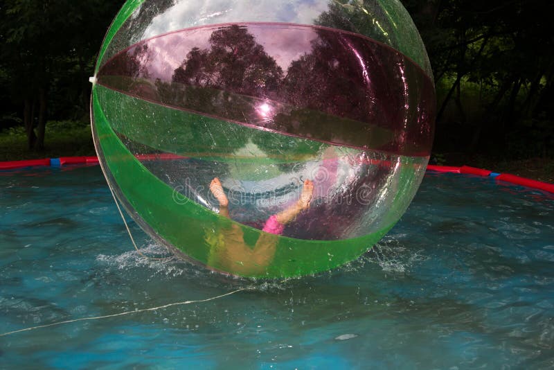 Little Girl in Zorb in the Pool Stock Image - Image of balloon, plastic ...