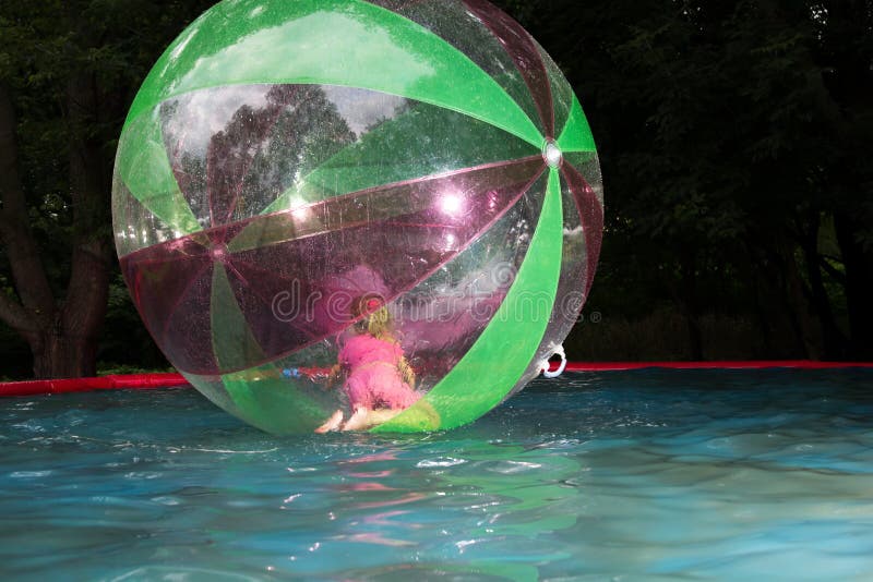 Little Girl in Zorb in the Pool Stock Photo - Image of people ...