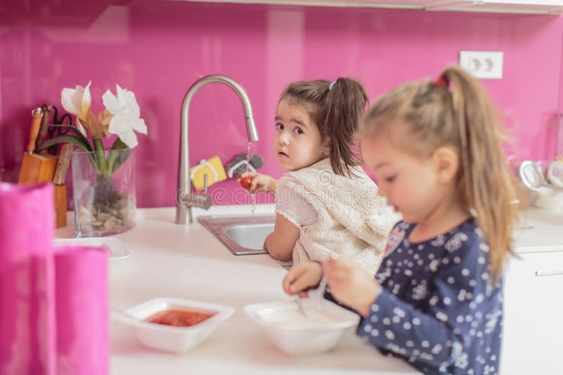 Little Girls in the Kitchen Stock Photo - Image of face, female: 38375172