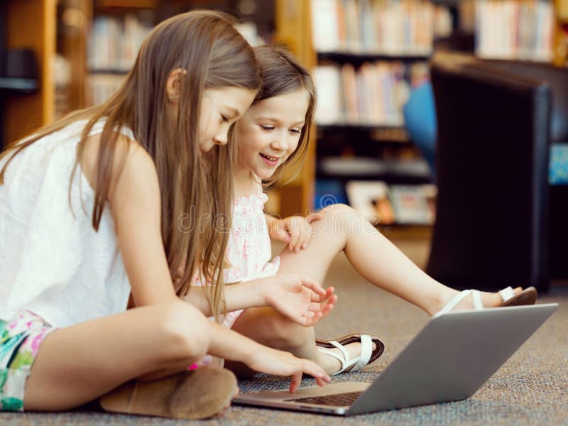 Technology and Fun in the Library Stock Image - Image of person, happy ...