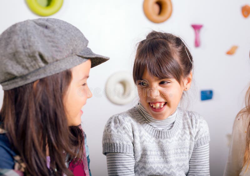 Little Girls Sitting and Talking in the Playroom Stock Photo - Image of ...