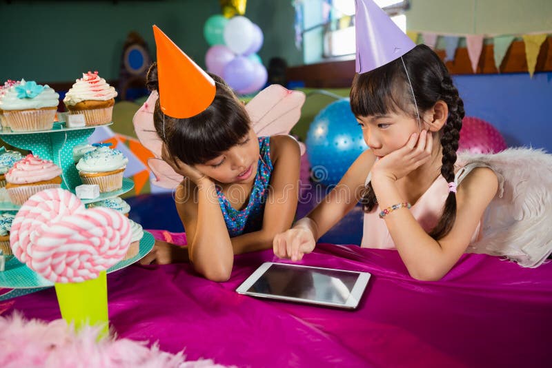 Little Girls Using Tablet at Party Stock Image - Image of celebration ...