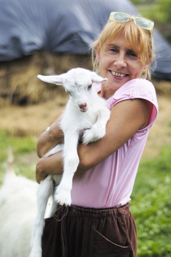 Goat and woman stock photo. Image of pastoral, meadow - 36940470