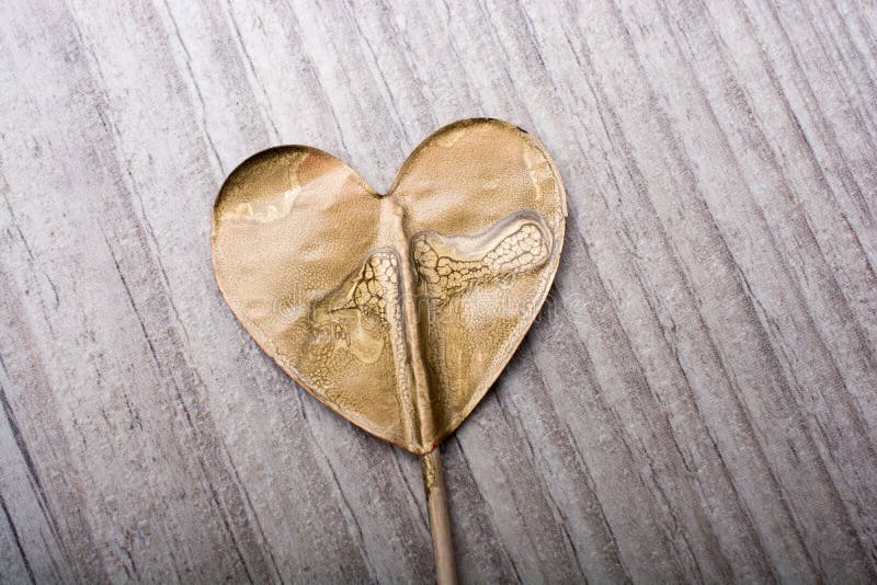 Little Gold Color Heart Shape in Hand Stock Illustration - Illustration ...