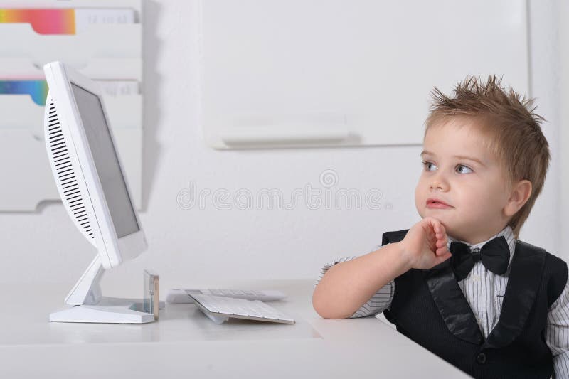 Little Handsome Boy Sits with a Computer Stock Photo - Image of view ...