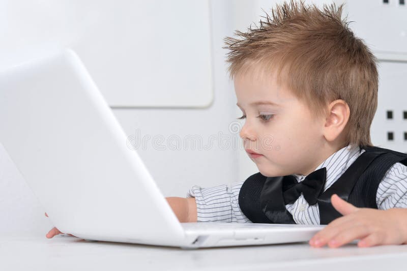 Little Handsome Boy Sits with a Computer Stock Image - Image of young ...