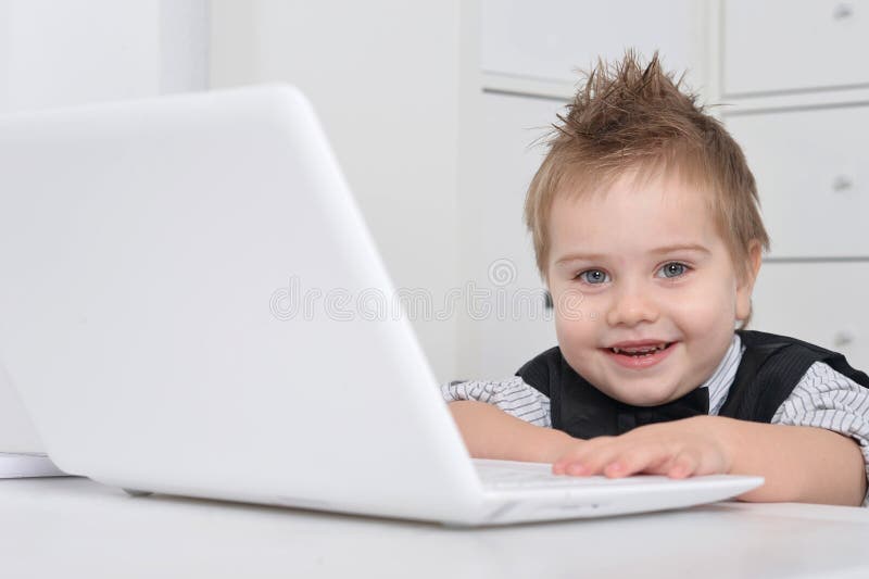 Little Handsome Boy Sits with a Computer Stock Photo - Image of sitting ...