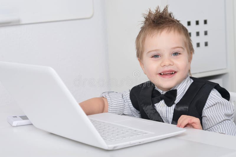 Little Handsome Boy Sits with a Computer Stock Image - Image of sitting ...