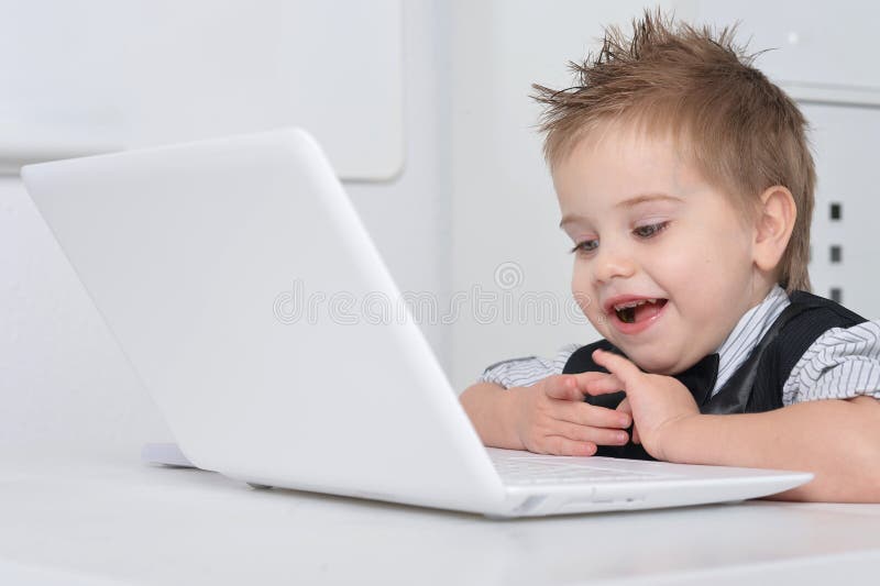 Little Handsome Boy Sits with a Computer Stock Image - Image of young ...