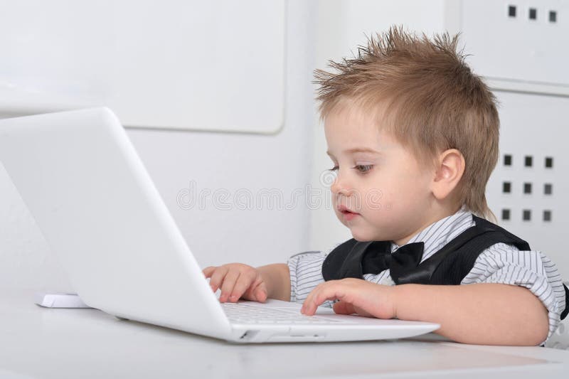 Little Handsome Boy Sits with a Computer Stock Photo - Image of game ...