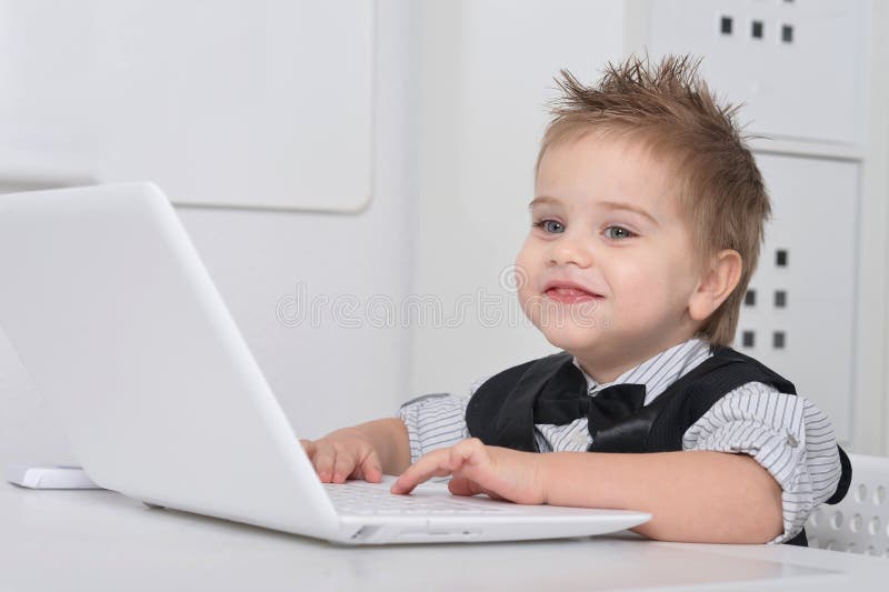 Little Handsome Boy Sits with a Computer Stock Image - Image of online ...