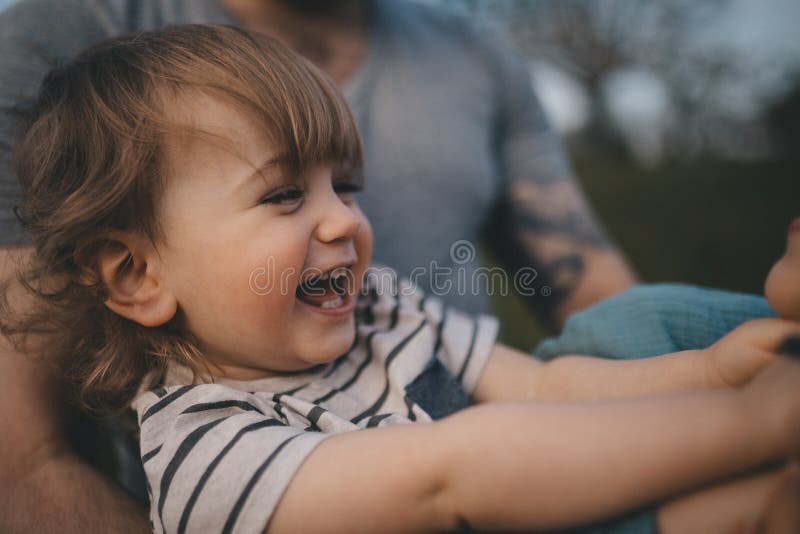 Little Happy Child with His Parents Outside. Stock Image - Image of ...