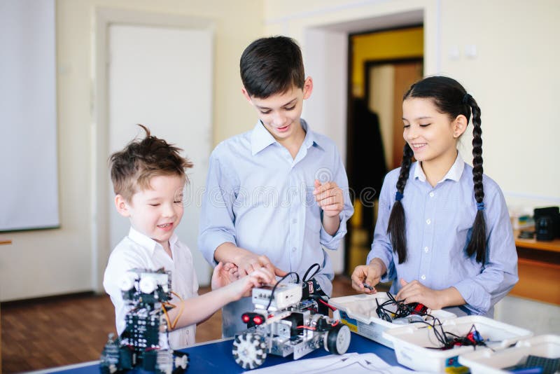 Kids Playing with Electrical Robot while Visiting Robotics Exhibition ...
