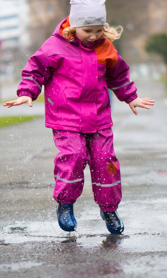Little Happy Girl Jumping in Puddle Stock Image - Image of autumn ...