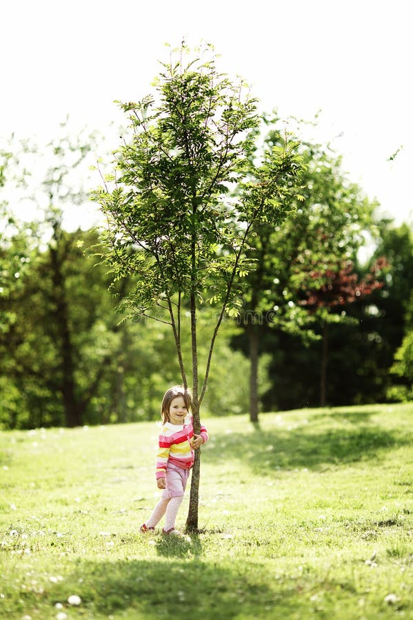 Little Happy Girl Near the Tree Stock Image - Image of outdoor ...