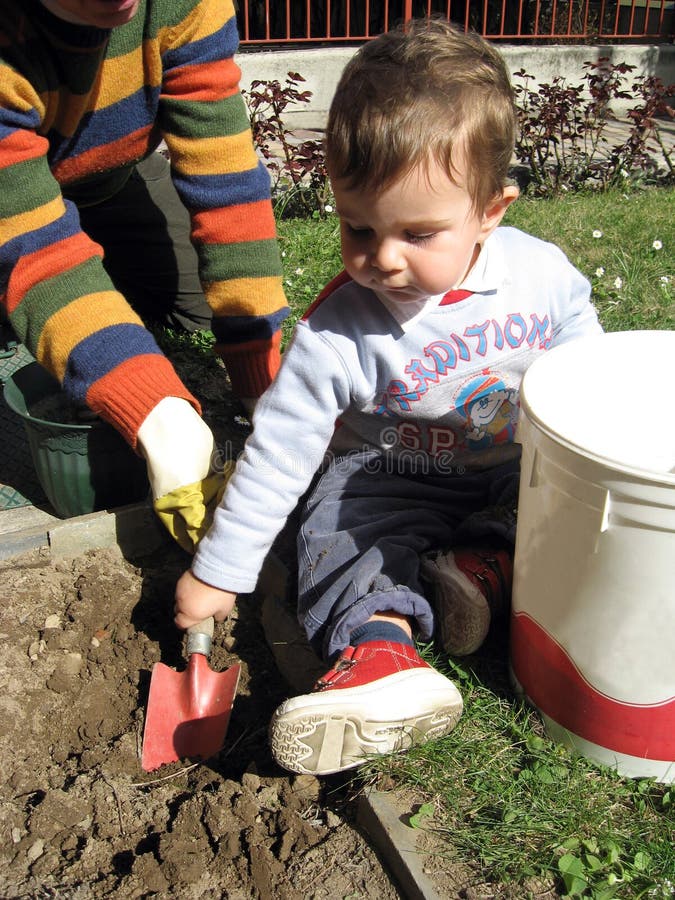 Boy digging in dirt stock photo. Image of little, cute - 4963464