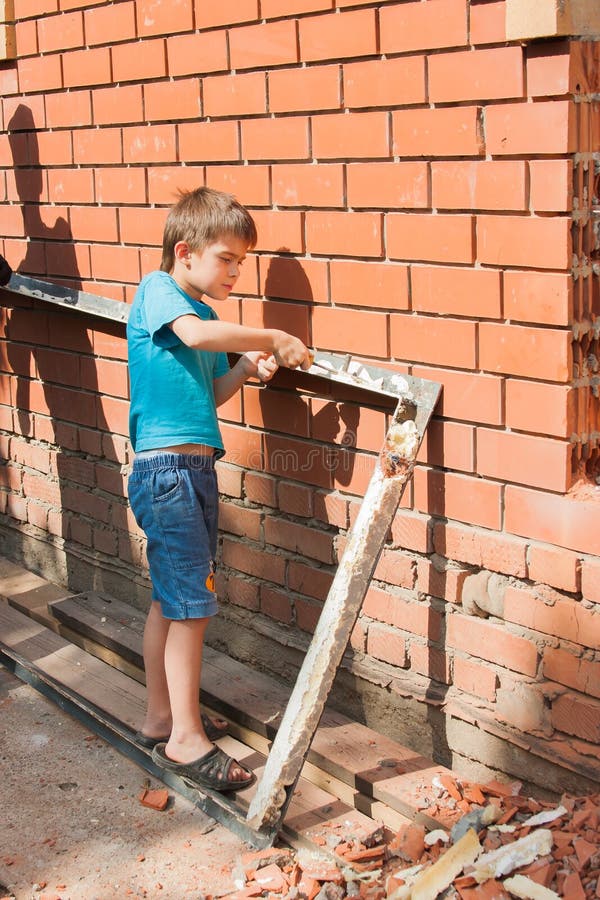 Little helper, boy at work stock image. Image of scope - 58929229