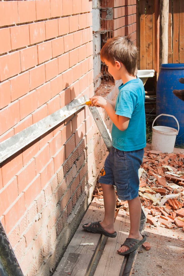 Little helper, boy at work stock image. Image of little - 58929631