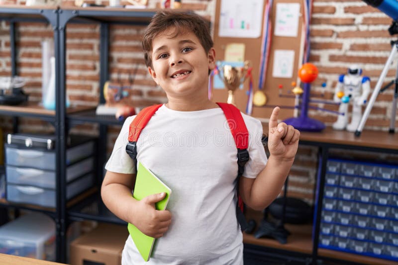 Little Hispanic Boy Wearing Student Backpack and Holding Book at School ...