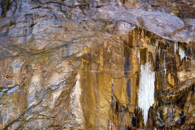 Icicle on a stone surface stock image. Image of closeup - 188862195