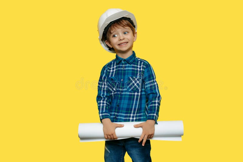 Little Kid Boy Engineer or Architect in a Protective Helmet Holding ...
