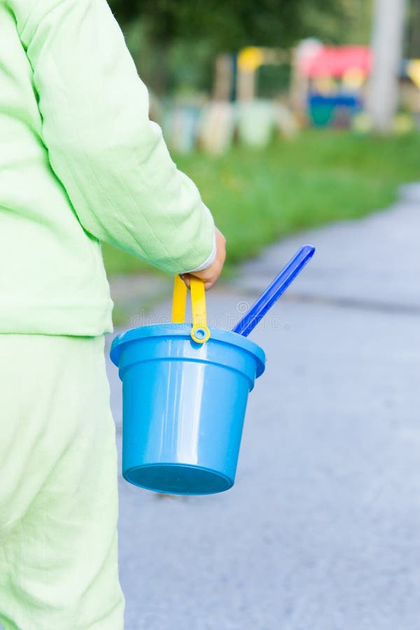 Little kid with a bucket stock image. Image of play, nature - 28594677