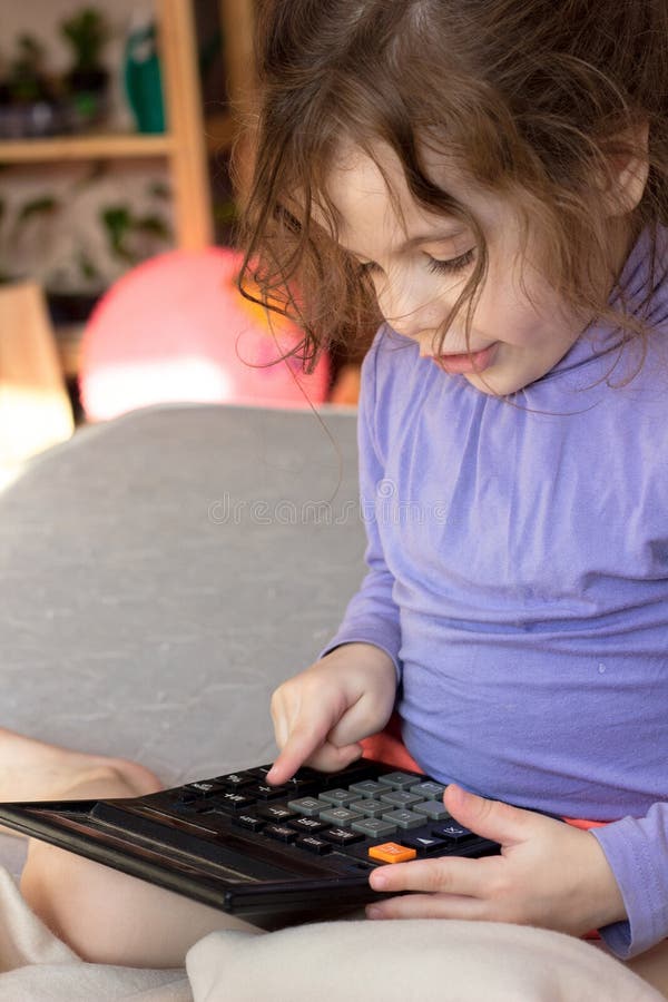 Little Kid Girl with a Calculator in Hands. Stock Image - Image of ...