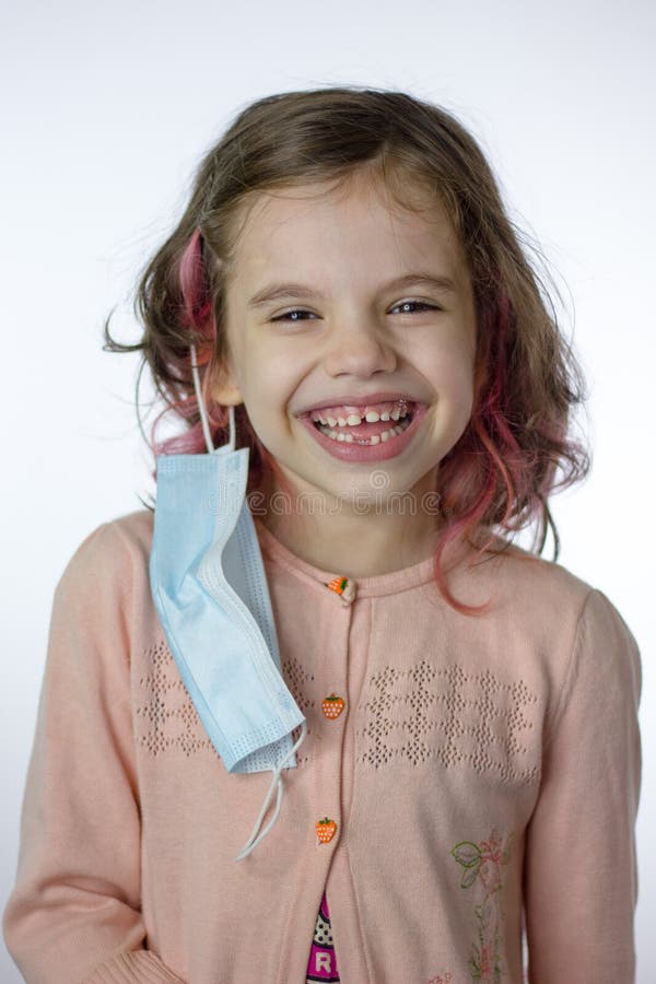 Little Kid Girl with the Mask on Ear Laughing Stock Image - Image of ...