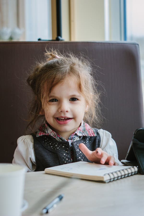 Little Kid Girl Writing or Drawing with Pen in Scetch Book Stock Image ...