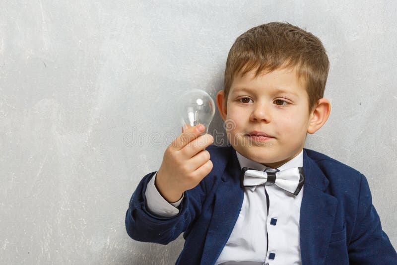Little Kid Holding a Light-bulb Stock Image - Image of childhood ...