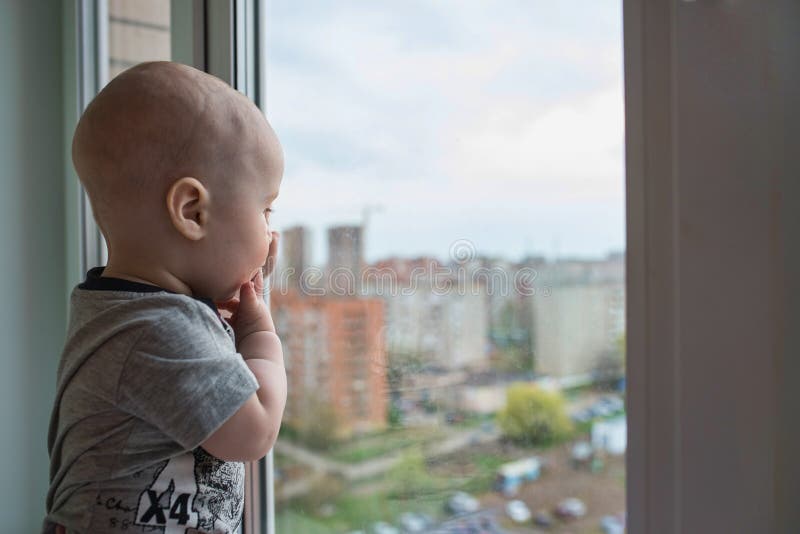 Little Kid Looking Window High Floor Stock Photos - Free & Royalty-Free ...