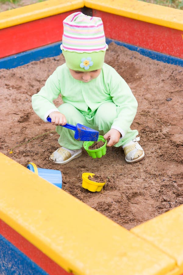 Little Kid Playing in a Sandbox Stock Image - Image of play, life: 28594303